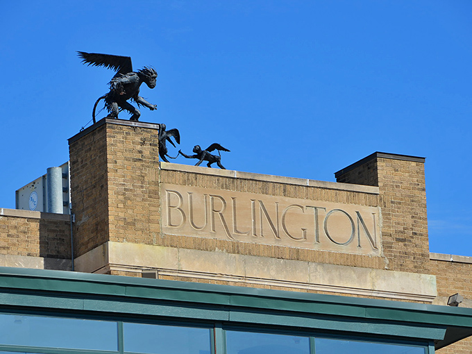 Metallic flying monkeys perched atop Burlington Station create an unexpected welcome, watching over travelers with mischievous charm and Oz-inspired whimsy.