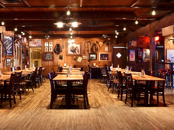 Handlebar J's rustic dining room welcomes hungry visitors with wooden tables, cowboy memorabilia, and the promise of smoky delights to come.