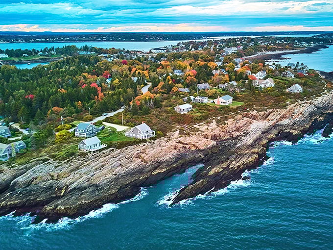 Harpswell's dramatic coastline showcases nature's artwork where forest meets sea, with colorful autumn foliage creating a perfect frame for the Atlantic's deep blues.