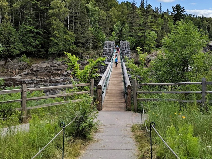 The iconic swinging bridge at Jay Cooke State Park invites brave souls to cross above the churning waters of the St. Louis River below.