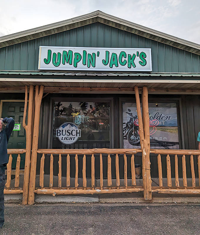 Jumpin' Jacks welcomes hungry travelers with its rustic log cabin exterior and bright green sign. A true North Branch landmark where comfort food reigns supreme!
