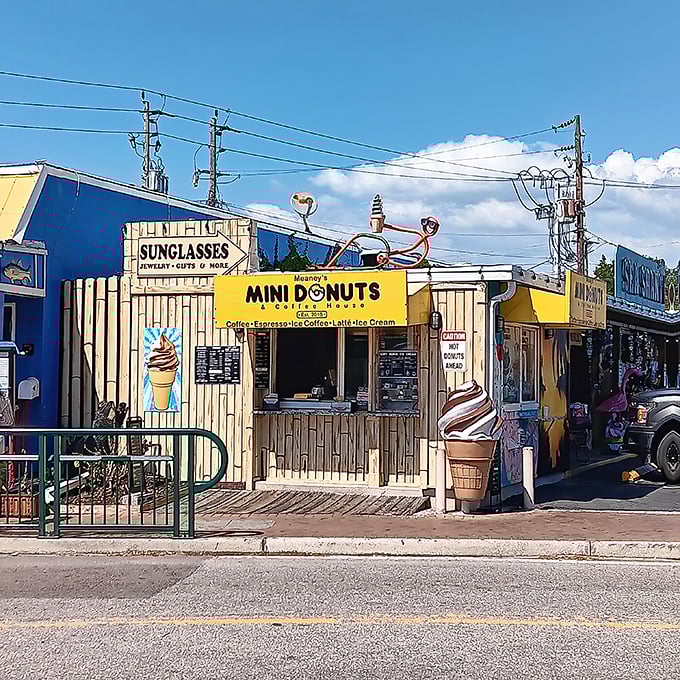 Meaney's cheerful yellow storefront beckons beach-goers with promises of mini donut delights and cool treats on hot Siesta Key days.