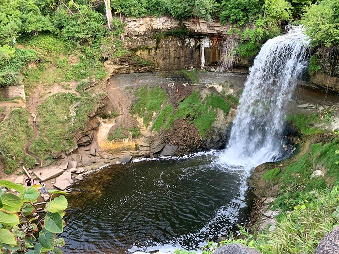 Minnehaha Falls crashes down like nature's own power shower, creating a misty spectacle that's been wowing visitors for generations.