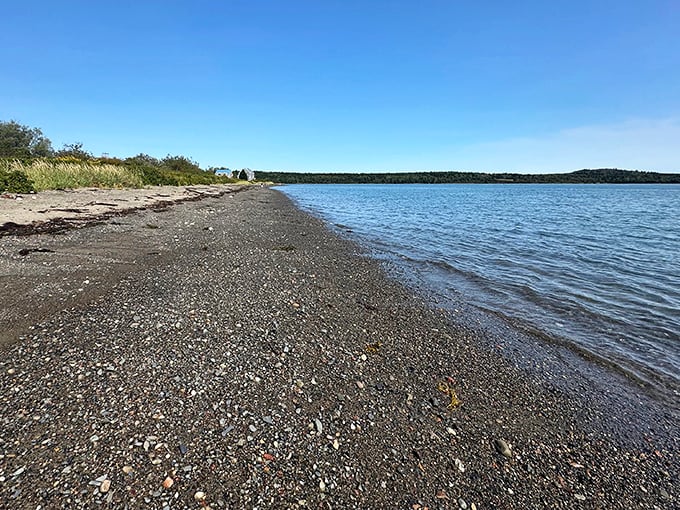 Mowry Beach's dark pebbles create the perfect backdrop for spotting colorful sea glass treasures along Maine's easternmost shoreline. 