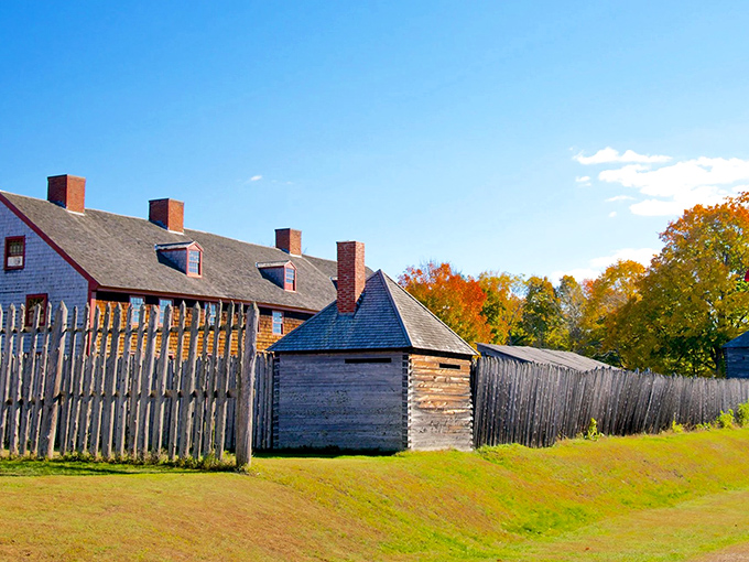 Old Fort Western stands proudly along the Kennebec River, its weathered wooden walls and watchtower telling stories of colonial Maine's frontier days.