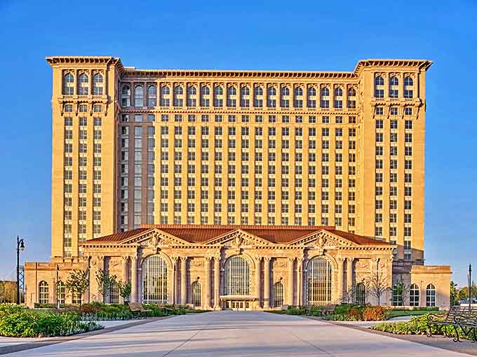 Michigan Central Station stands proud against the blue sky, its grand architecture a testament to travel's golden age.