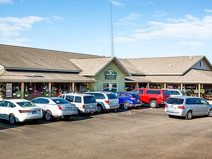 Yoder's Country Market welcomes hungry visitors with its sprawling wooden structure and packed parking lot. This isn't just shopping &ndash; it's a delicious adventure!