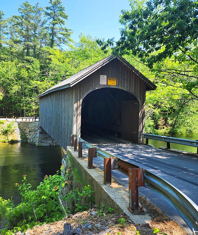 Sunlight dances through the wooden slats of Babb's Bridge, creating a warm glow that highlights its historic craftsmanship.