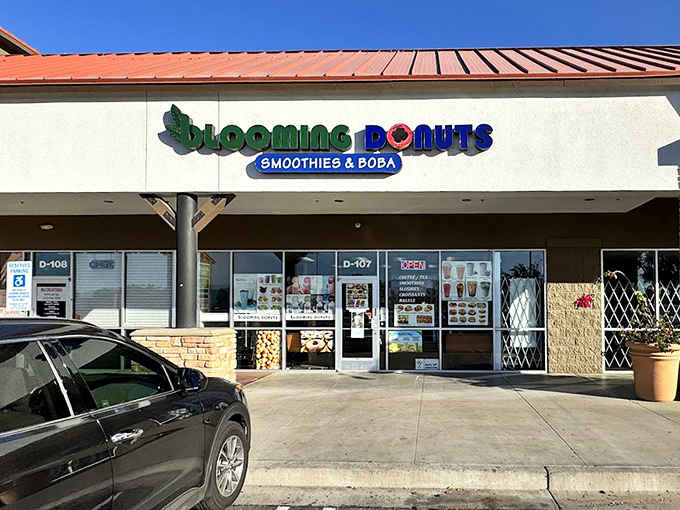 The inviting storefront of Blooming Donuts stands ready to rescue morning commuters with fresh treats and colorful boba drinks.