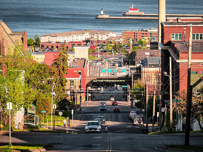Duluth's hillside geography creates stunning vistas where city streets lead the eye directly to Lake Superior's vast blue waters and the iconic harbor entrance.