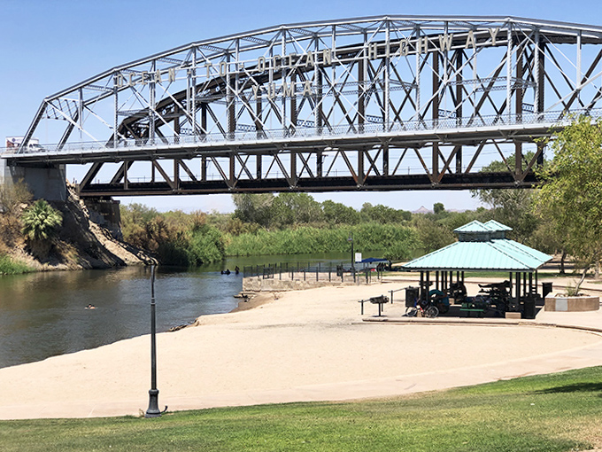Families gather under shady ramadas at Gateway Park, where the Colorado River provides a cool escape from Yuma's desert heat.