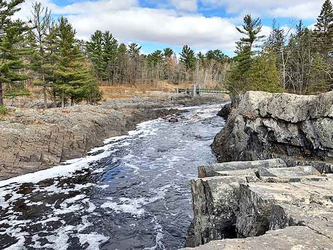Ancient slate rocks create natural sculptures in the St. Louis River, carved by centuries of persistent water flow through the gorge.