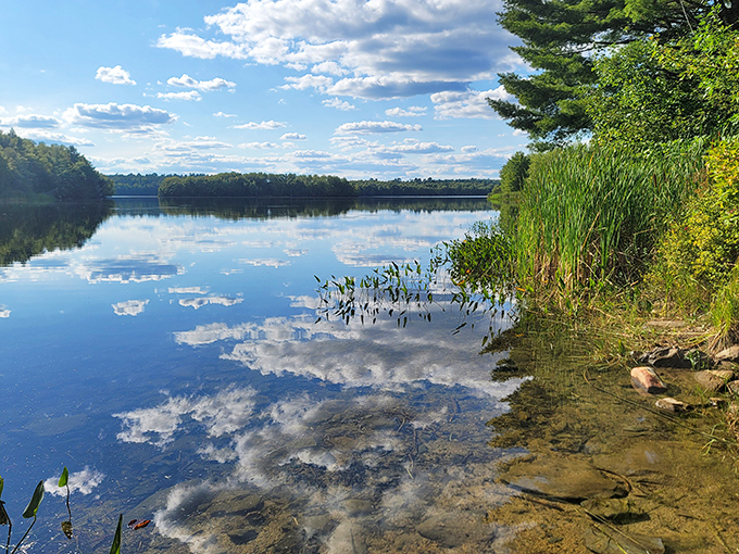 Clouds dance across both sky and water at Silver Lake, where the stillness creates nature's most perfect mirror.
