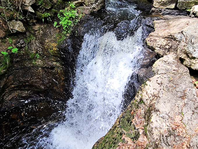 The white ribbon of water at Snow Falls creates a perfect contrast against the dark granite walls.