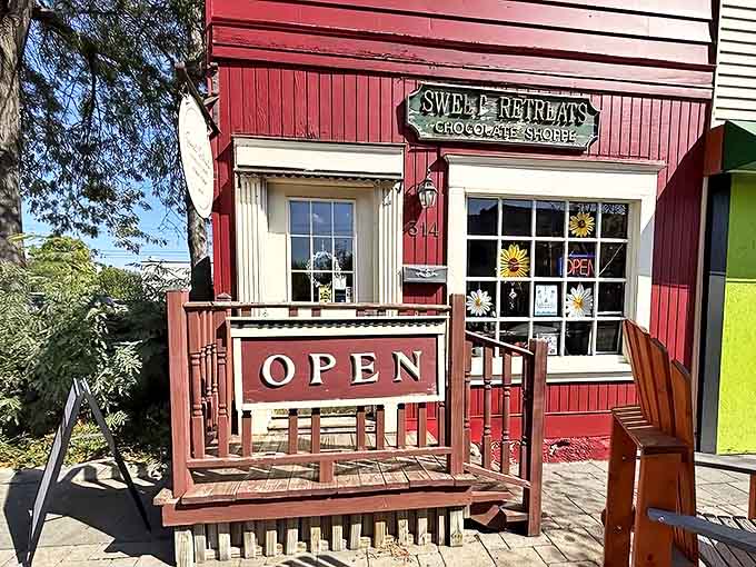 Sweet Retreats' bright red exterior pops against the green trees, like a candy-colored beacon for sweet-toothed travelers. The perfect first stop on your chocolate journey!