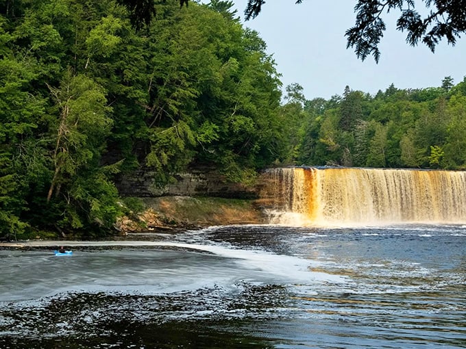 The wide, powerful cascade of Tahquamenon Falls demonstrates why it's known as Michigan's most impressive waterfall, especially beautiful on sunny days.