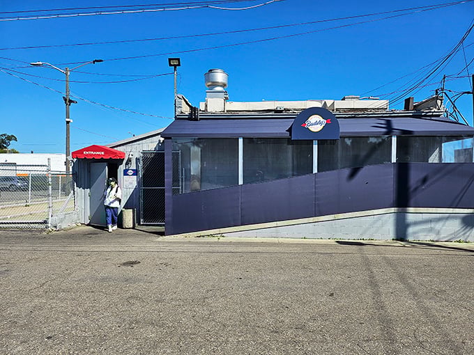 The unassuming entrance to Buddy's Pizza belies the flavor revolution inside, where Detroit's square pizza tradition has been perfected since the 1940s.