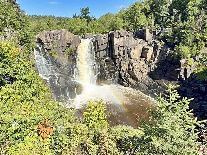 Mother Nature showing off again &ndash; a perfect rainbow arcs through the mist at High Falls, like she's saying "You're welcome."