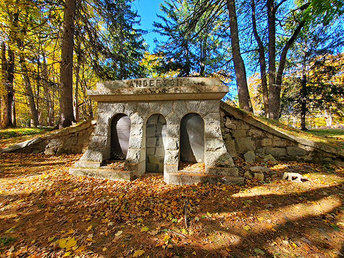 The imposing Anderson family crypt stands as a silent sentinel of history, its three arched entrances rumored to represent different pathways to the afterlife.