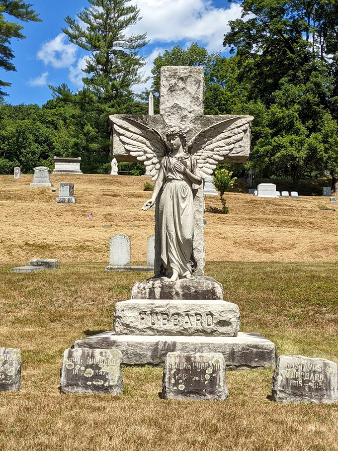 This weathered guardian watches eternally over the Hubbard family plot, her wings symbolizing the soul's journey beyond earthly bounds.