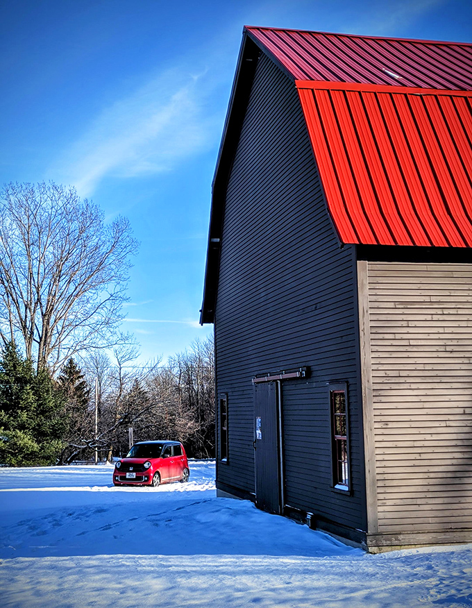 Winter reveals the barn's striking silhouette against snowy grounds &ndash; this isn't just any old farm building, it's a time portal to prehistoric seas.