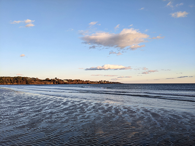 Tranquil tides meet endless sky at Higgins Beach, where Maine's coastal charm unfolds in peaceful waves.
