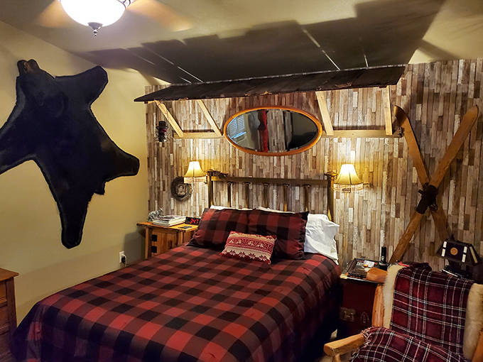 Snuggle up in this rustic, lodge-inspired room featuring warm buffalo plaid and whimsical decor for a perfect night's sleep.
