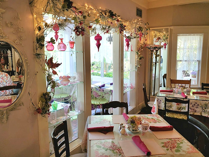 Fairy lights and floral garlands transform ordinary windows into enchanted portals where tea and conversation flow equally well.