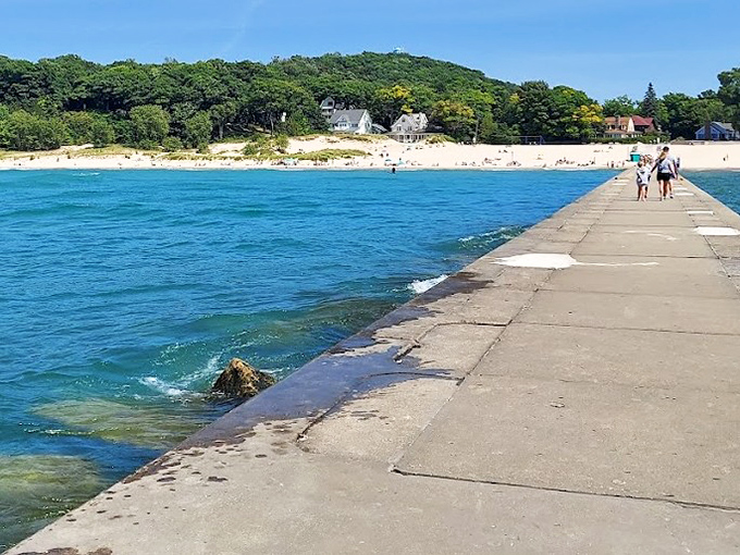 The crystal-clear waters of Lake Michigan meet pristine sandy shores at Frankfort's public beach, a slice of paradise.
