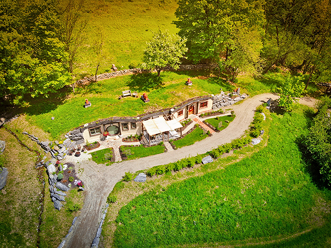 Aerial view revealing how perfectly this Middle-earth inspired dwelling nestles into Vermont's rolling countryside.