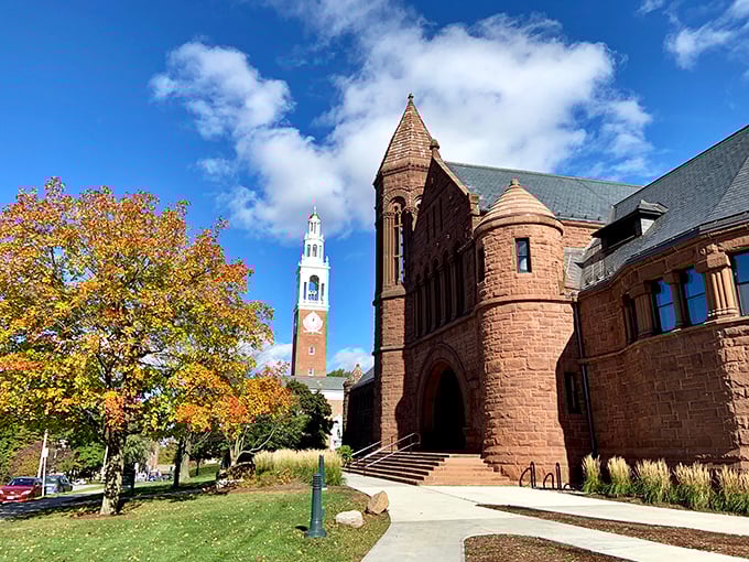Weathered stone and autumn foliage frame the clock tower, where time seems to move at its own leisurely Vermont pace.