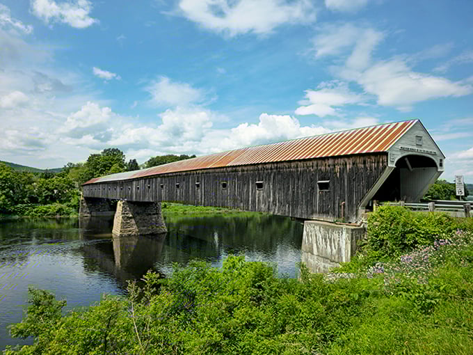 America's longest wooden covered bridge stretches 460 feet across the Connecticut River, connecting two states with timeless New England charm.