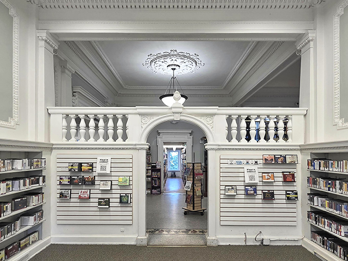 Step inside and be transported to a bygone era where ornate balustrades and elegant archways frame literary treasures waiting to be discovered.