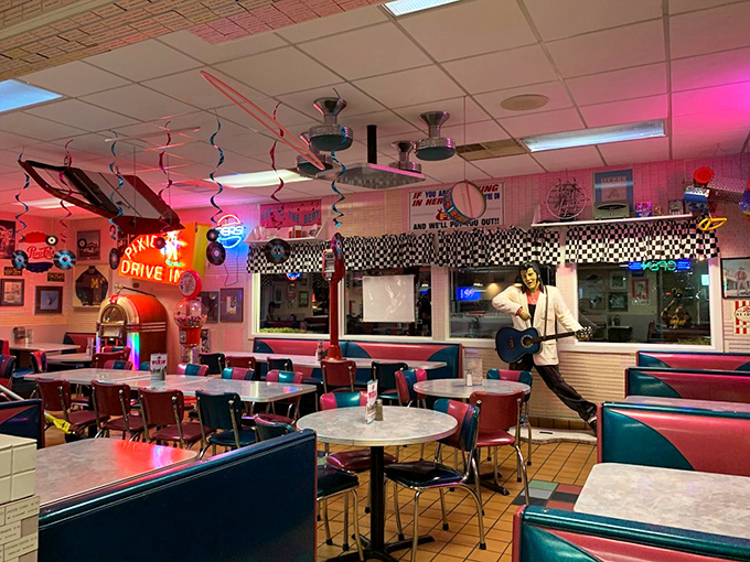 Step into this time-warp wonderland where checkerboard patterns meet neon glow, creating the perfect backdrop for comfort food adventures.