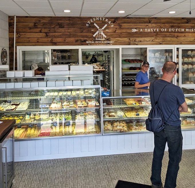 Behind that rustic wooden counter, magic happens daily. The display cases are like treasure chests filled with edible gold that would make any Dutch grandmother proud.