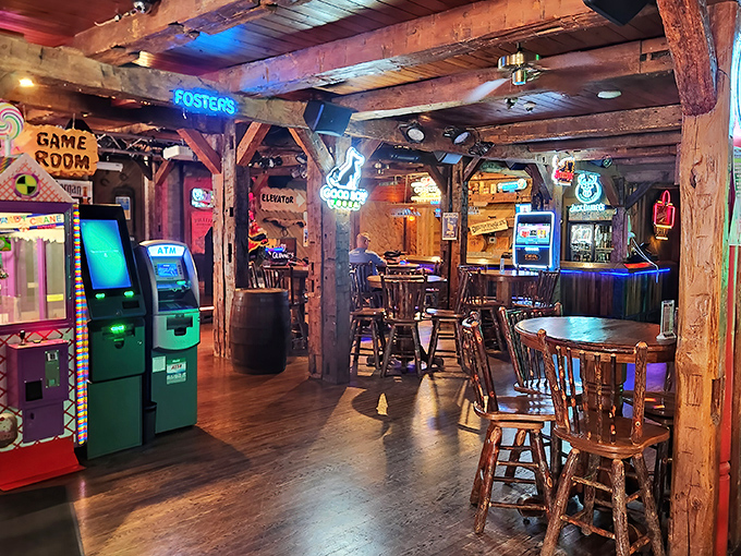 Exposed beams, neon signs, and arcade games create a rustic playground where adults can rediscover their inner child.