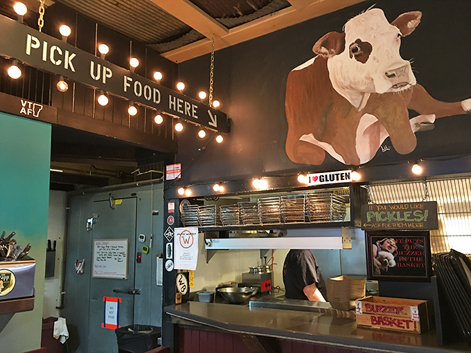 "Pick Up Food Here" &ndash; simple instructions at a place where the food speaks volumes. That cow knows what's up!