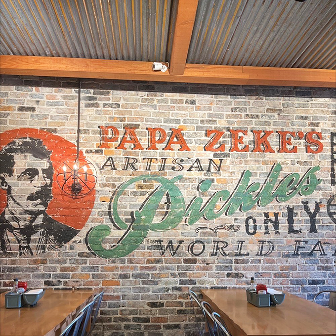 Exposed brick walls showcase the Papa Zeke's Artisan Pickles mural, setting the perfect backdrop for this pickle-lover's paradise in Michigan.