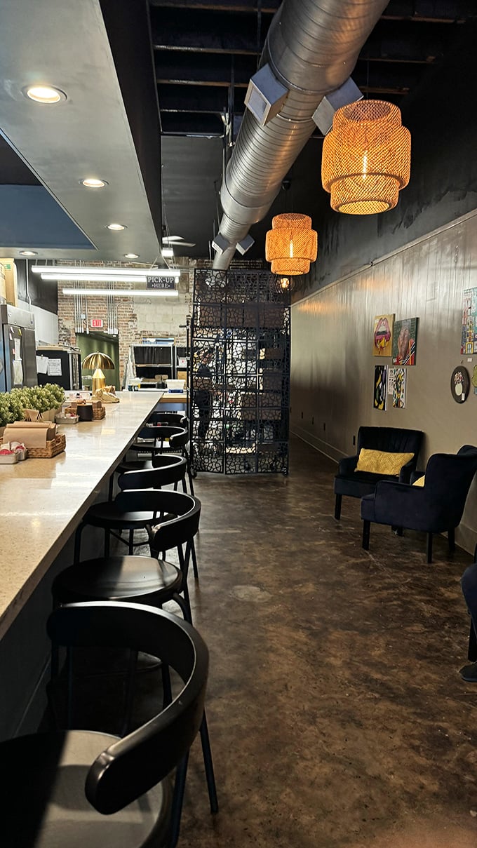 Exposed ductwork meets warm lighting and sleek countertops. Industrial-chic meets homey comfort in this pie lover's paradise.