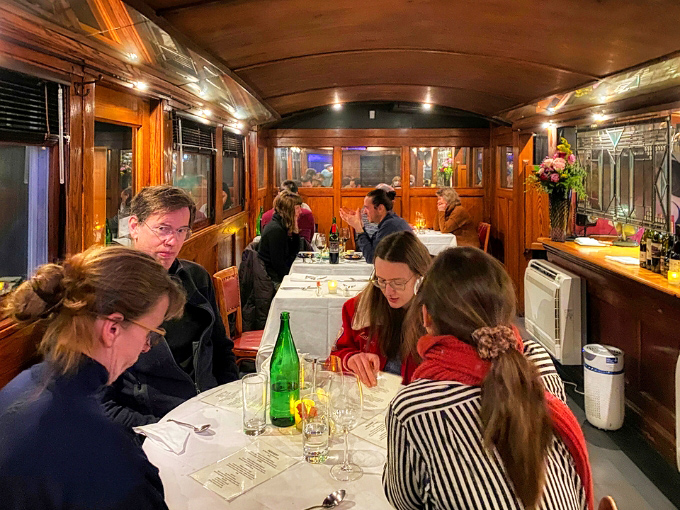 Warm wooden paneling and intimate seating create a dining atmosphere that feels like being wrapped in Vermont's coziest culinary sweater.