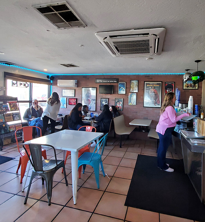 Colorful metal chairs and comic book décor create a playful atmosphere where superhero fans and foodies unite in burger bliss.