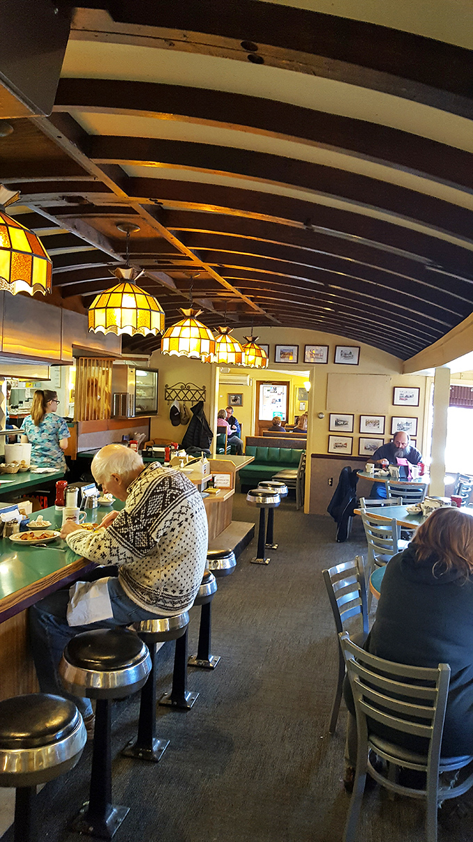 Step inside to find Tiffany-style lights, green vinyl booths, and that authentic diner vibe that makes you want to order everything on the menu.