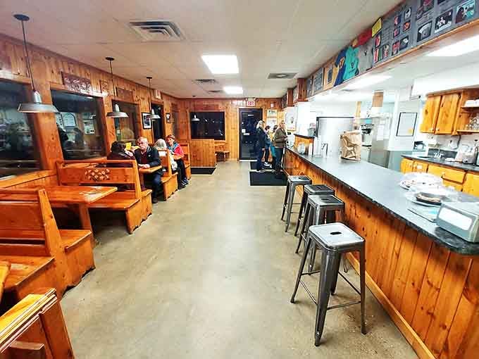 Warm wood paneling and cozy booths create the perfect atmosphere for ice cream contemplation and family conversations.