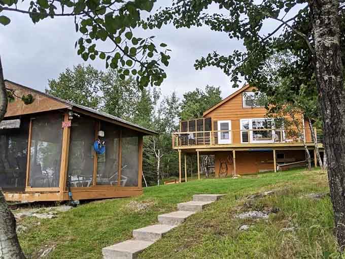 The main cabin and screened porch create the perfect base camp for your island adventure, offering comfort without sacrificing that authentic lakeside charm.
