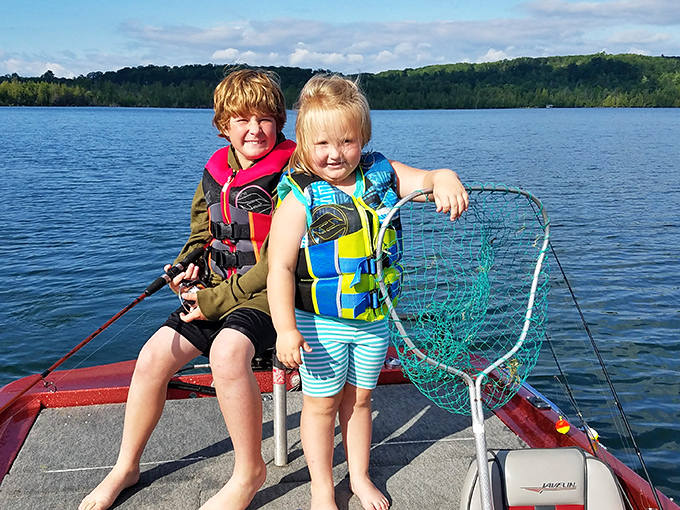 Future fishing champions at work! These youngsters are learning the art of patience and the thrill of the catch.