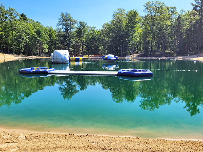 Crystal clear waters invite summer splashing with colorful inflatables dotting the spring-fed lake like playful water lilies.