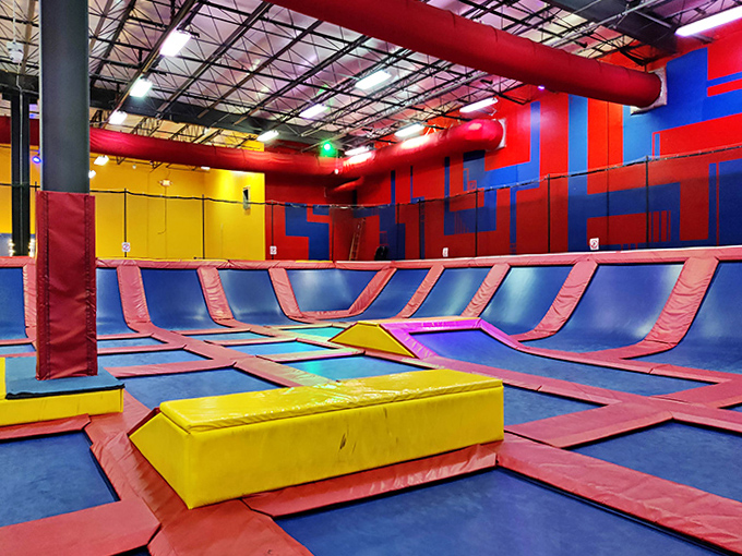 Large Trampoline Area: Defying physics one bounce at a time in this springy wonderland where everyone's suddenly an aspiring Olympic gymnast.