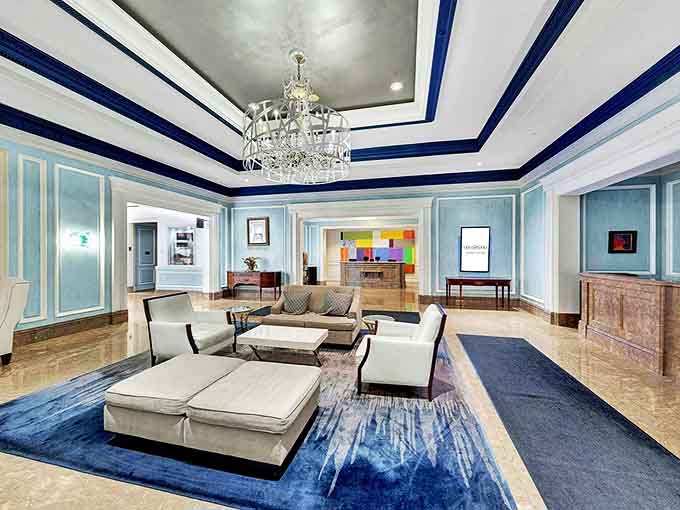 The lobby welcomes with plush seating and artistic flair &ndash; where checking in feels like entering a sophisticated friend's living room.