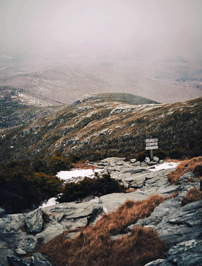 Misty mountain magic unfolds as clouds embrace the ridgeline, creating a dramatic landscape that changes by the minute.
