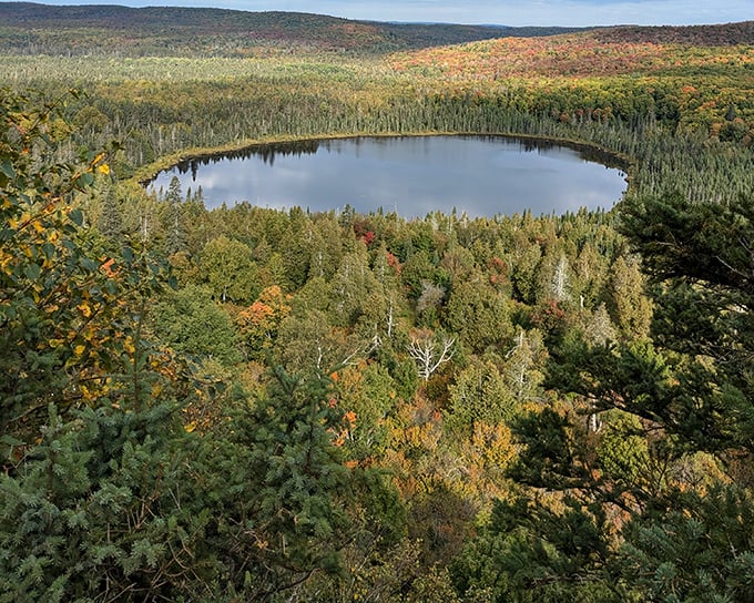 Nature's perfect mirror: Oberg Lake's still waters create a double-take worthy reflection of Minnesota's vibrant forest canopy.
